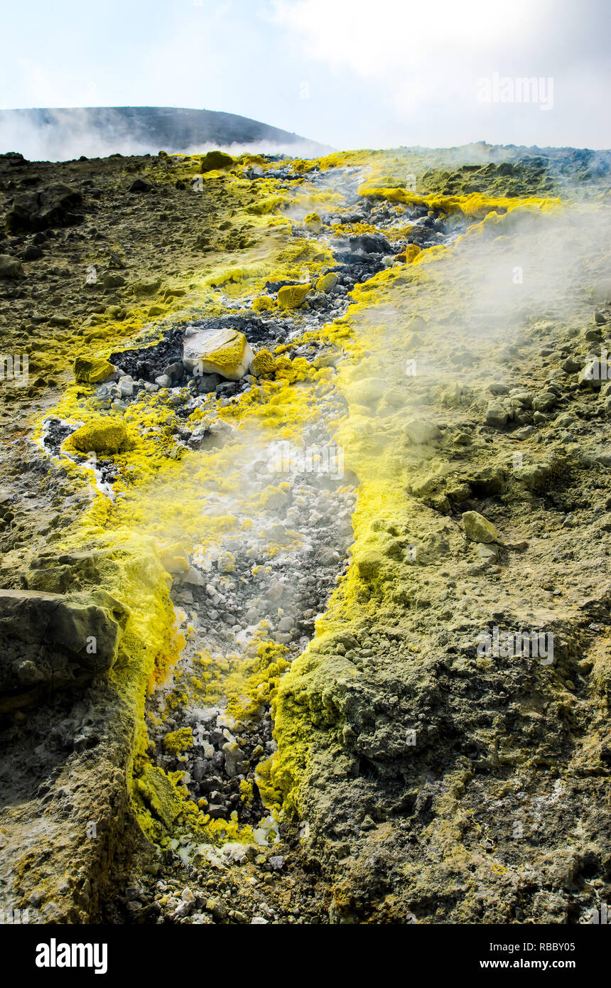 Yellow Sulphur crystals on surface rocks of a volcano crater on the ...