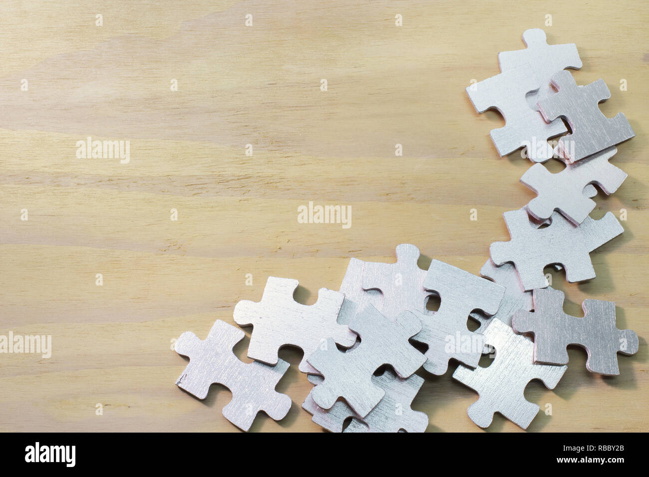 Wooden jigsaw puzzle pieces hi-res stock photography and images - Alamy
