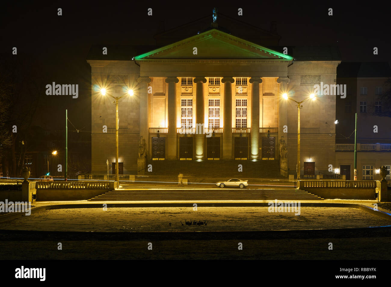 classical Opera building during the night in Poznan, Poland Stock Photo ...