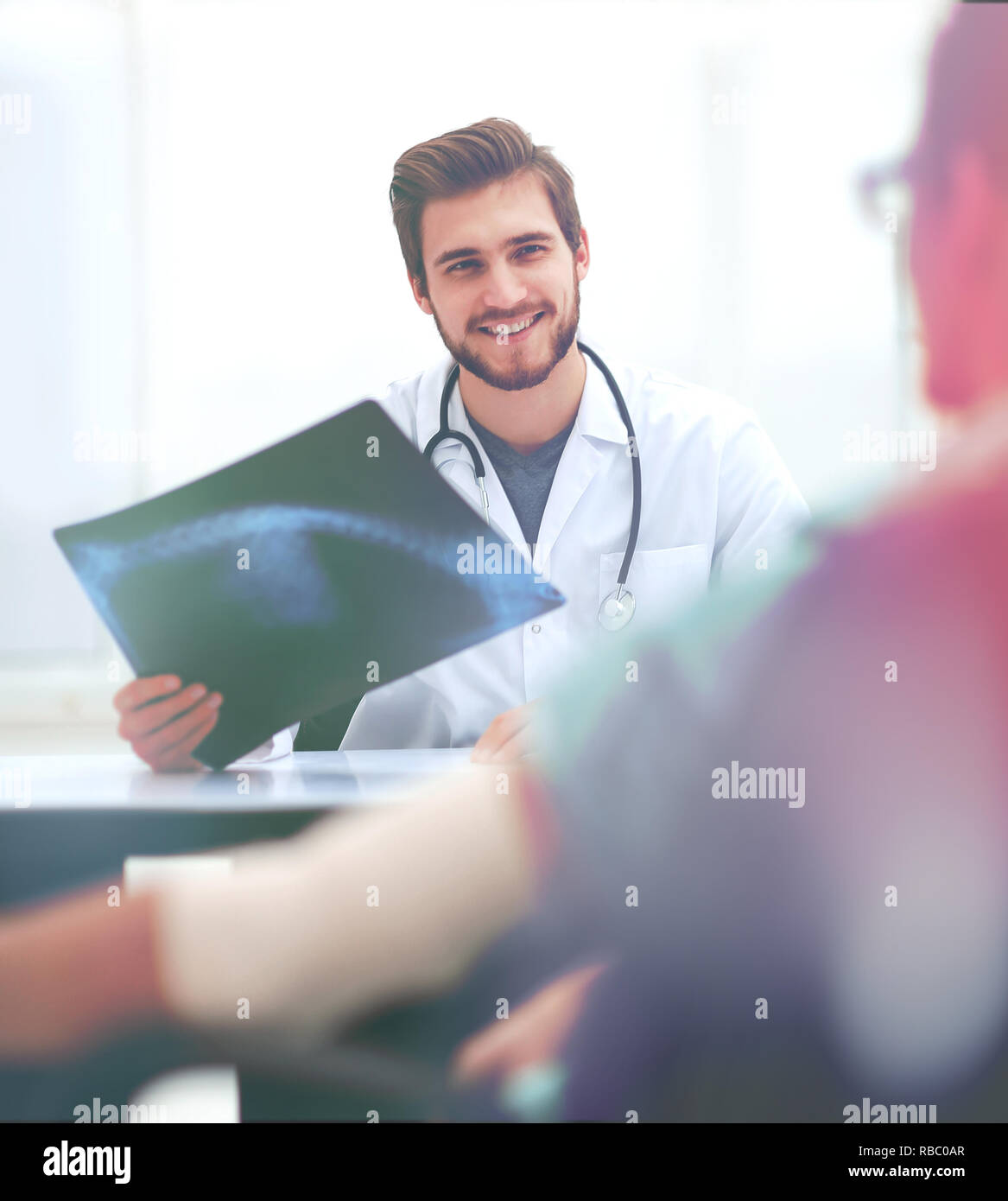 doctor examining x-ray picture of the patient Stock Photo - Alamy