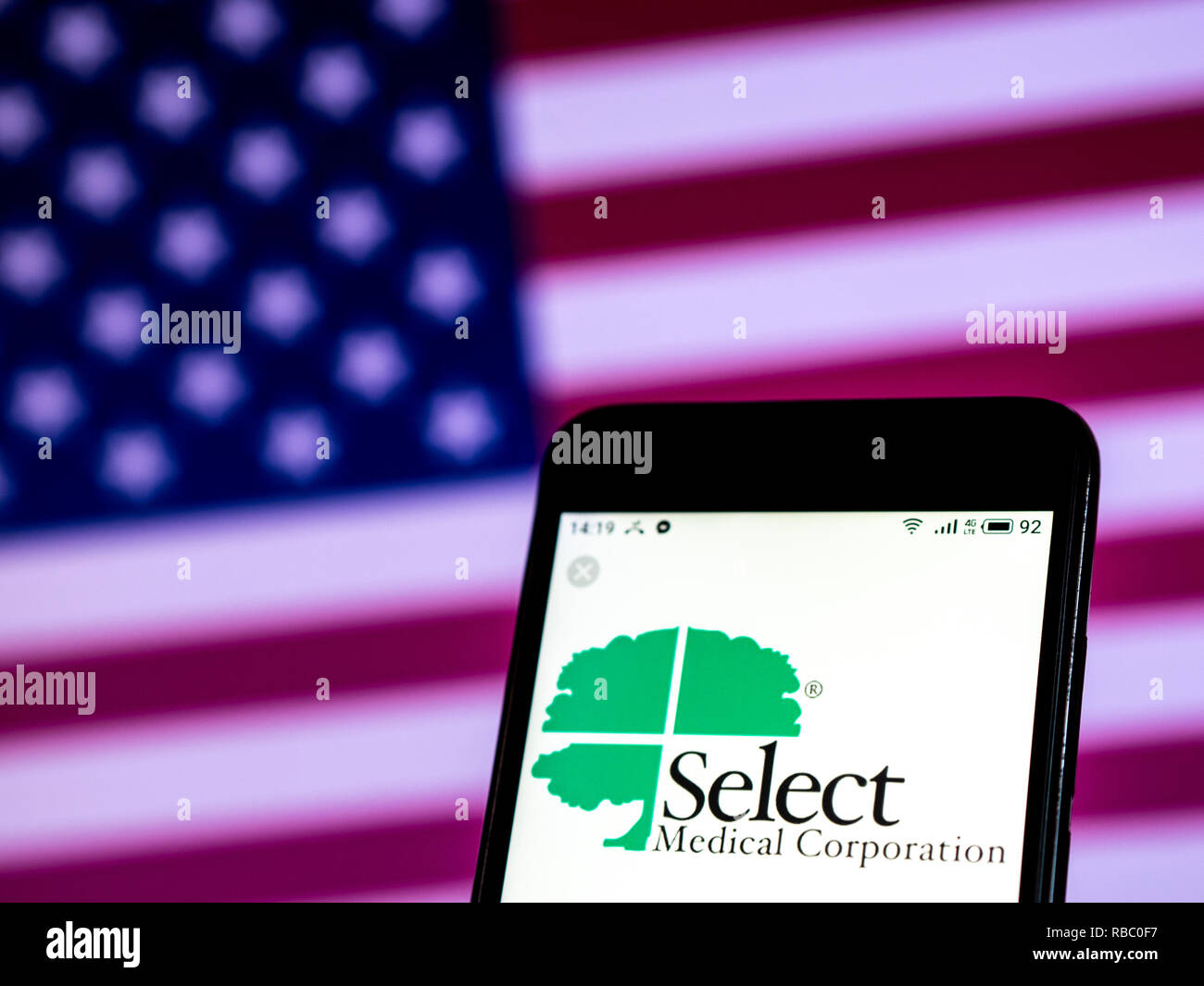 Select Medical Healthcare company logo seen displayed on smart phone ...