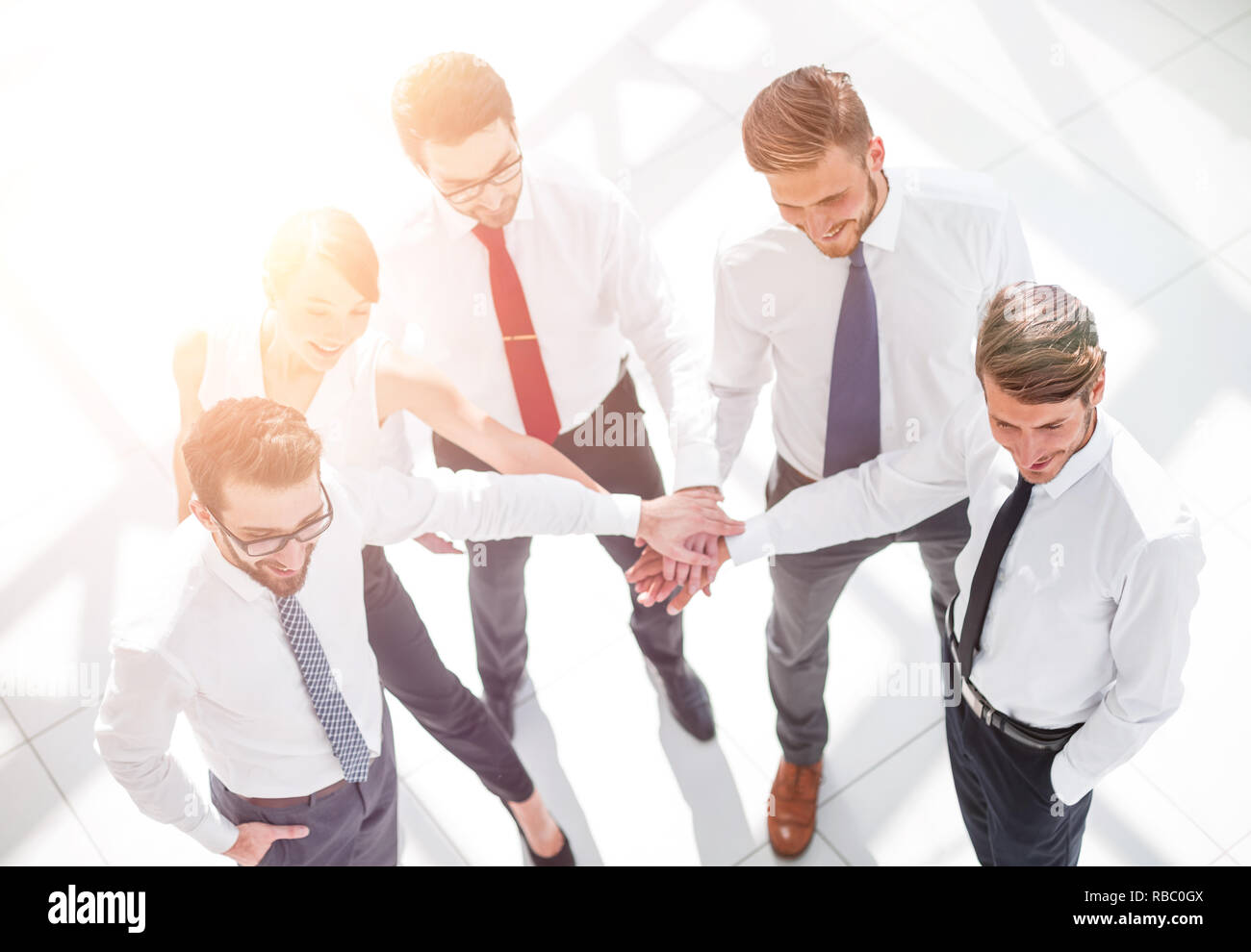 top view. young employees showing their unity Stock Photo - Alamy