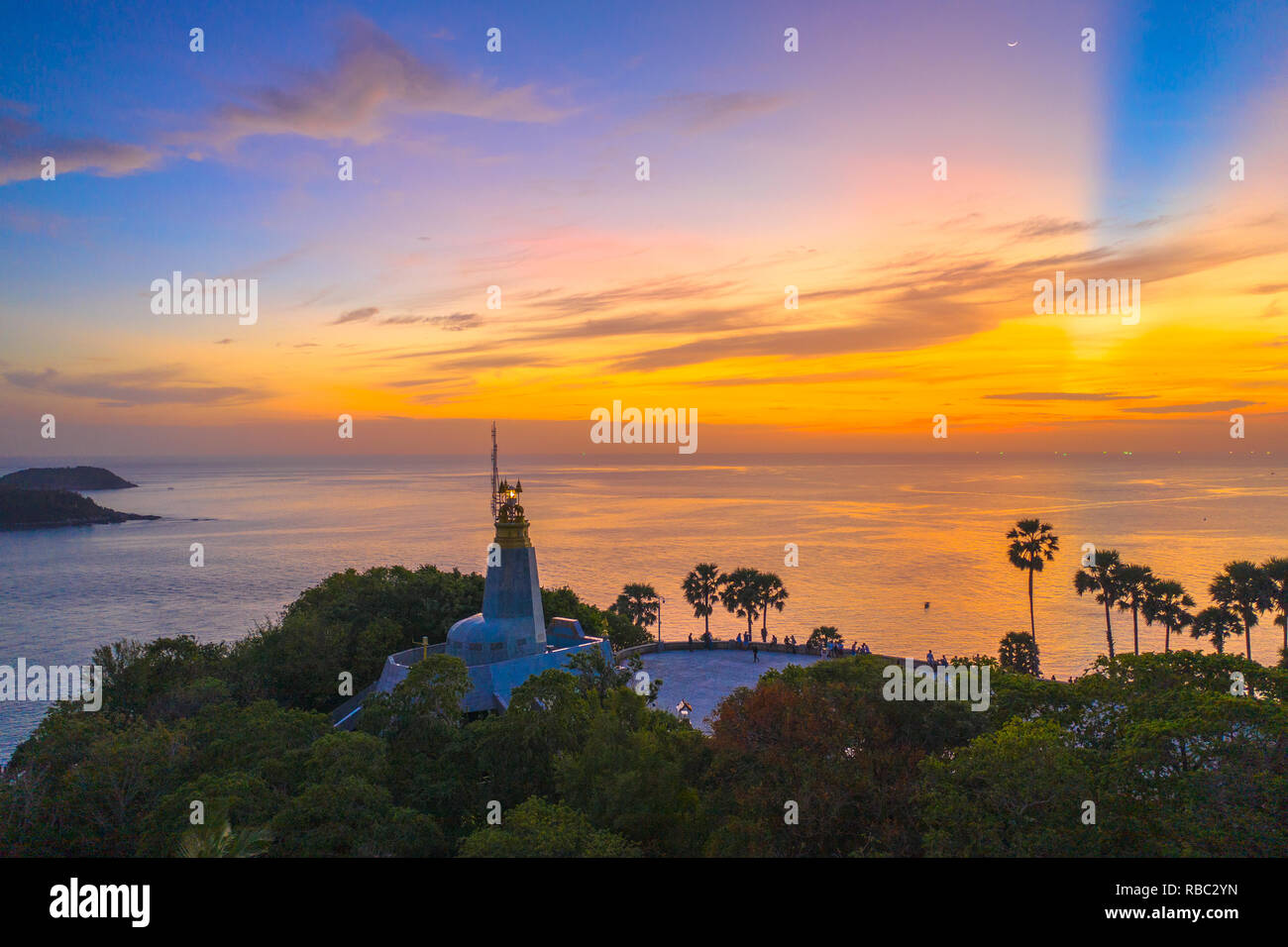 sunset above the great lighthouse at Promthep cape Phuket Thailand ...