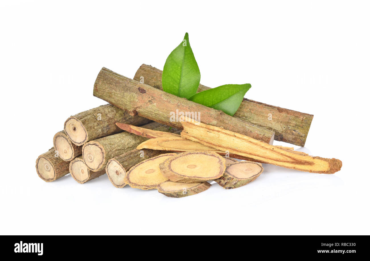 Slice Licorice roots on white background Stock Photo - Alamy