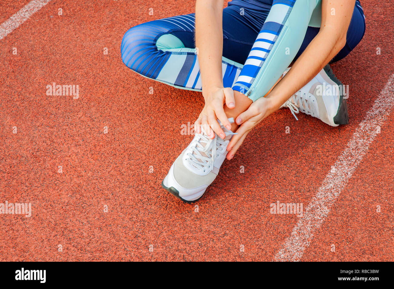 Leg Injury. Woman runner suffering from pain in leg after workout is ...