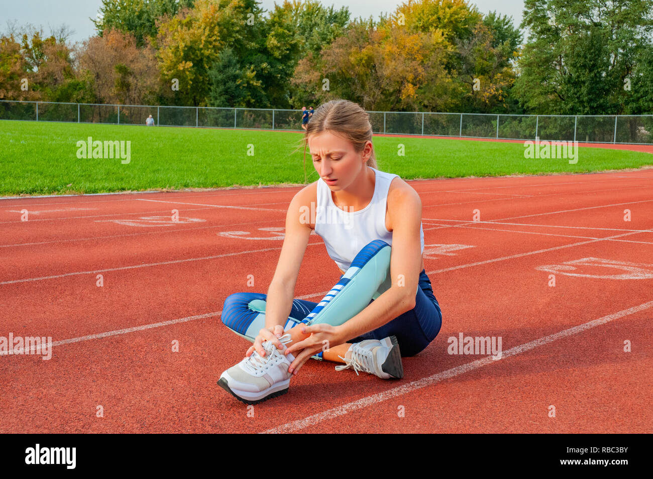 Leg Injury. Woman runner suffering from pain in leg after workout is ...