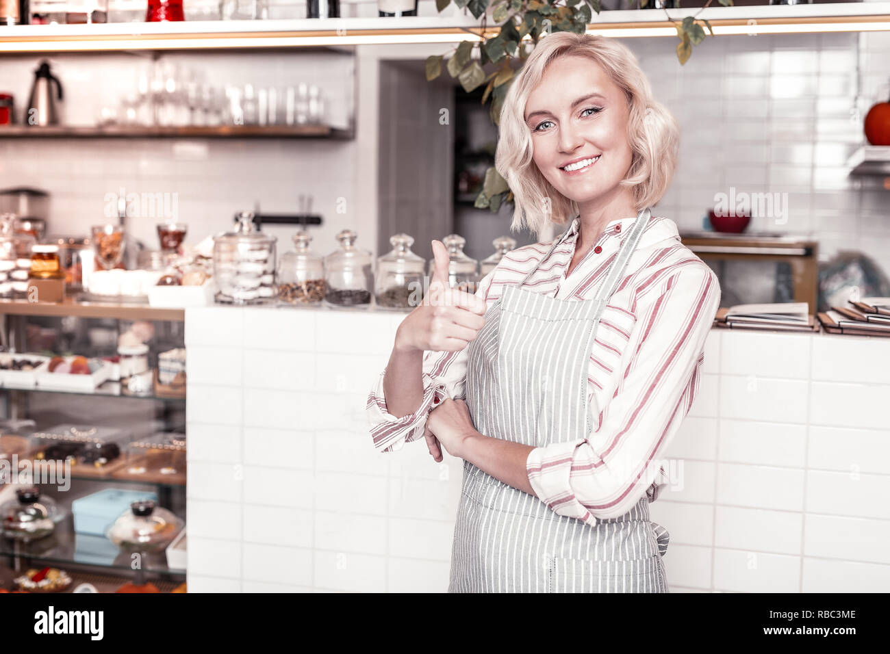 Happy delighted woman showing you OK sign Stock Photo - Alamy