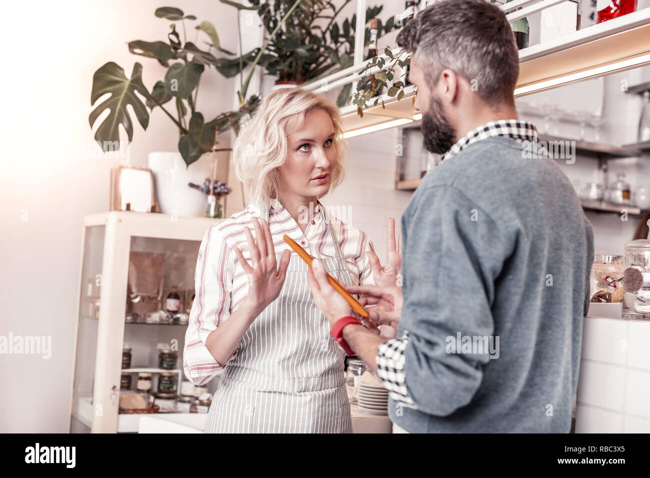 Cheerless young people having a disagreement in their views Stock Photo ...