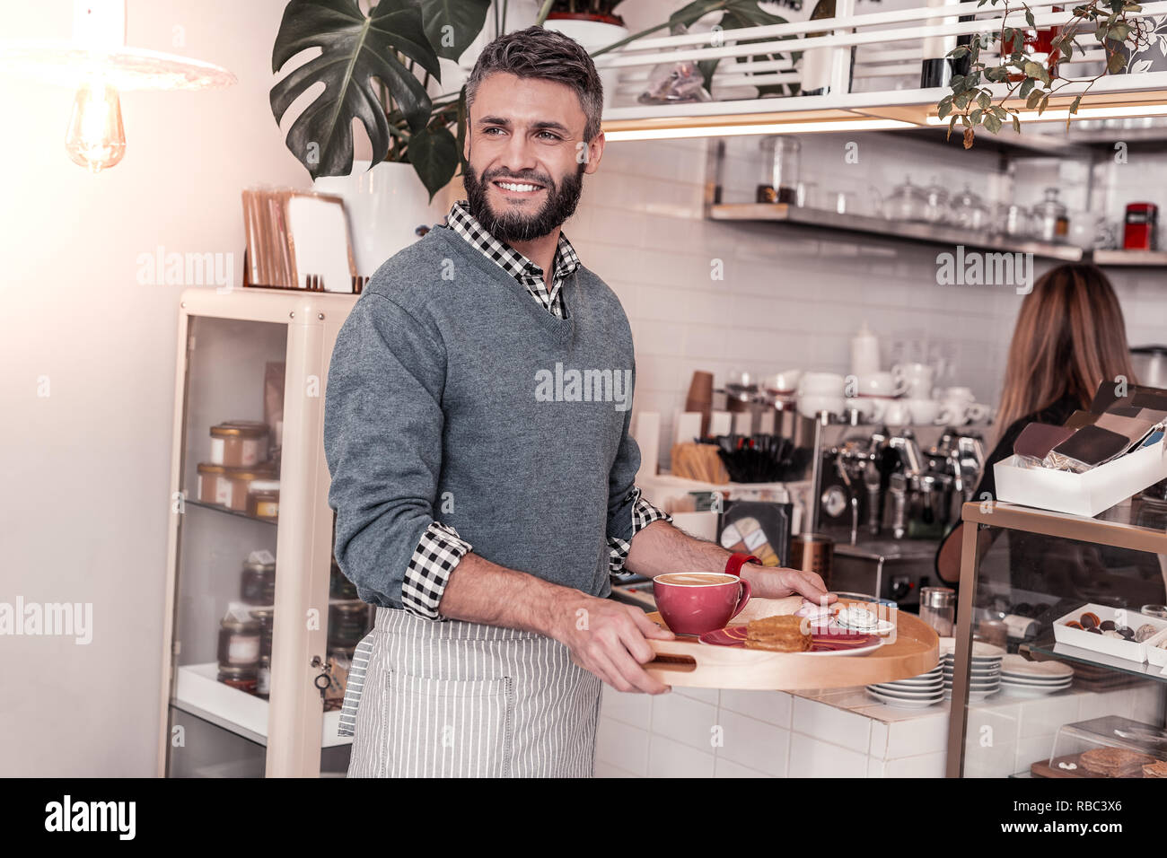 Man holding a tray hi-res stock photography and images - Alamy