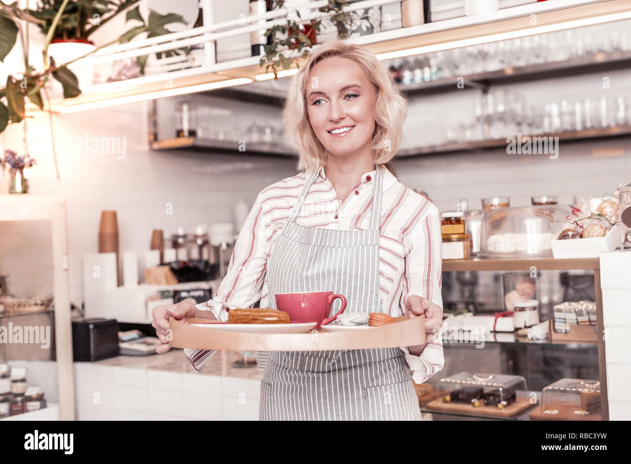 Woman serving breakfast cafe hi-res stock photography and images - Alamy