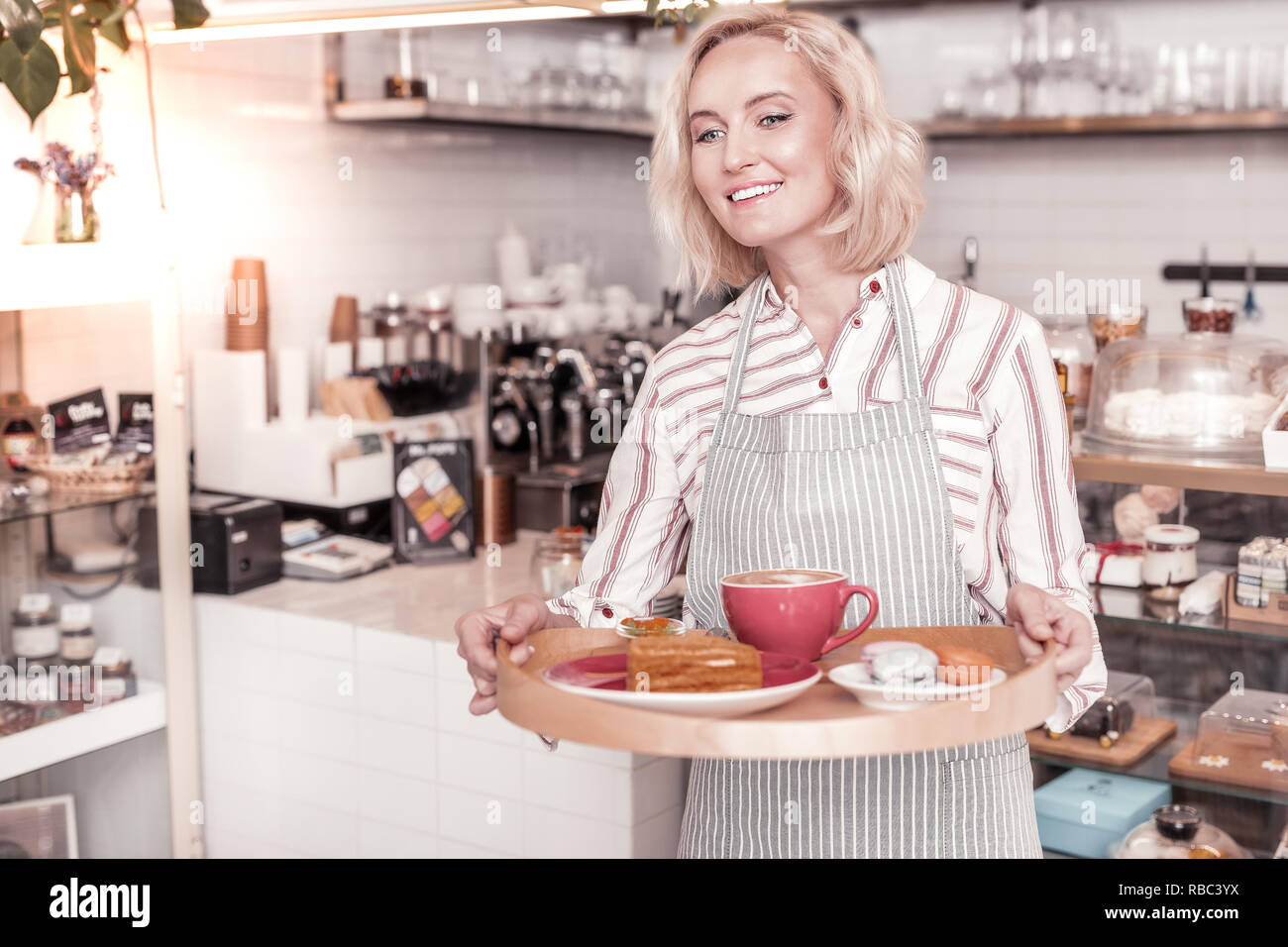 Woman serving breakfast hi-res stock photography and images - Alamy