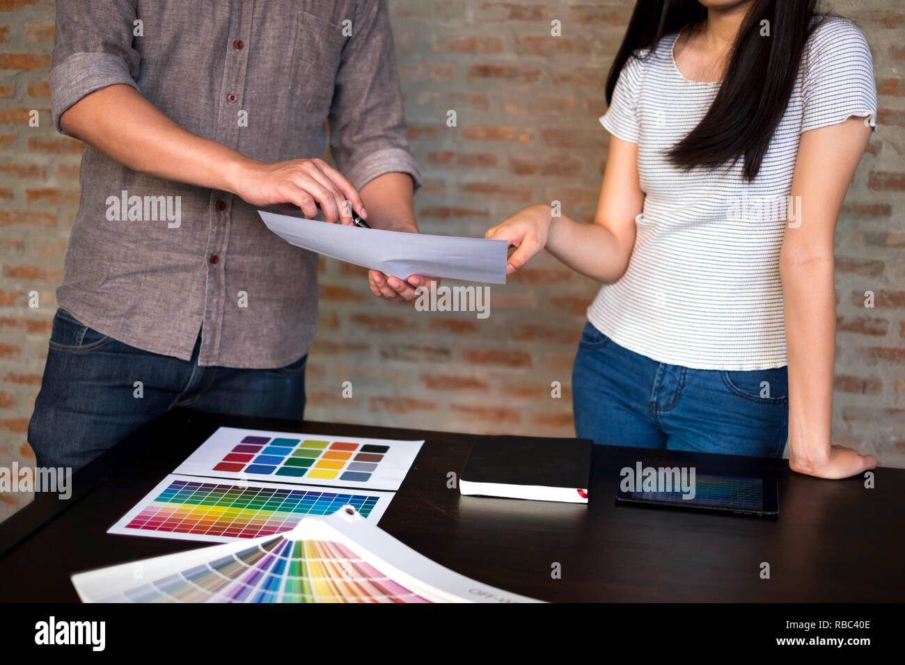 Graphic designers choose colors from the color bands samples for design ...