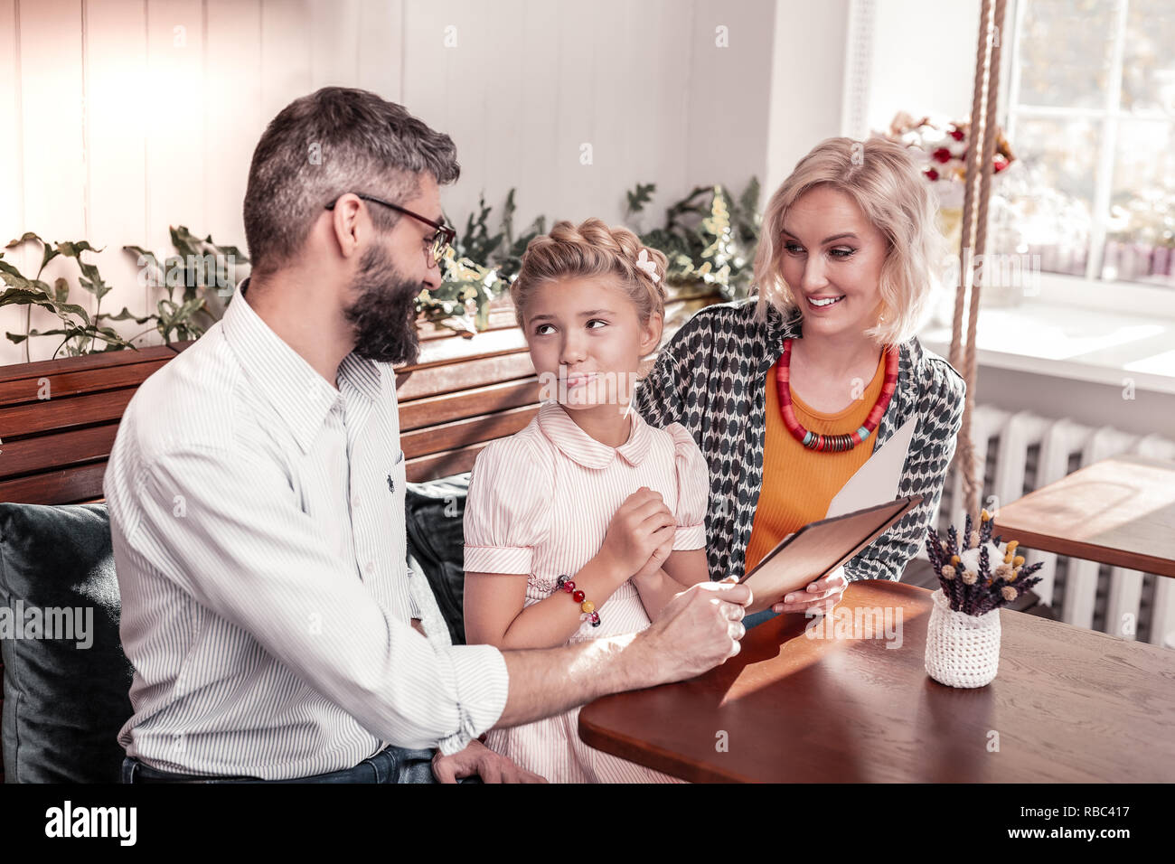 Nice cute girl asking to order a dessert Stock Photo - Alamy