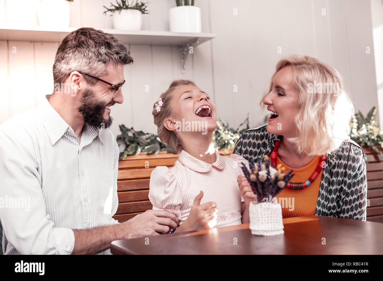 Happy cute nice girl laughing a lot Stock Photo - Alamy