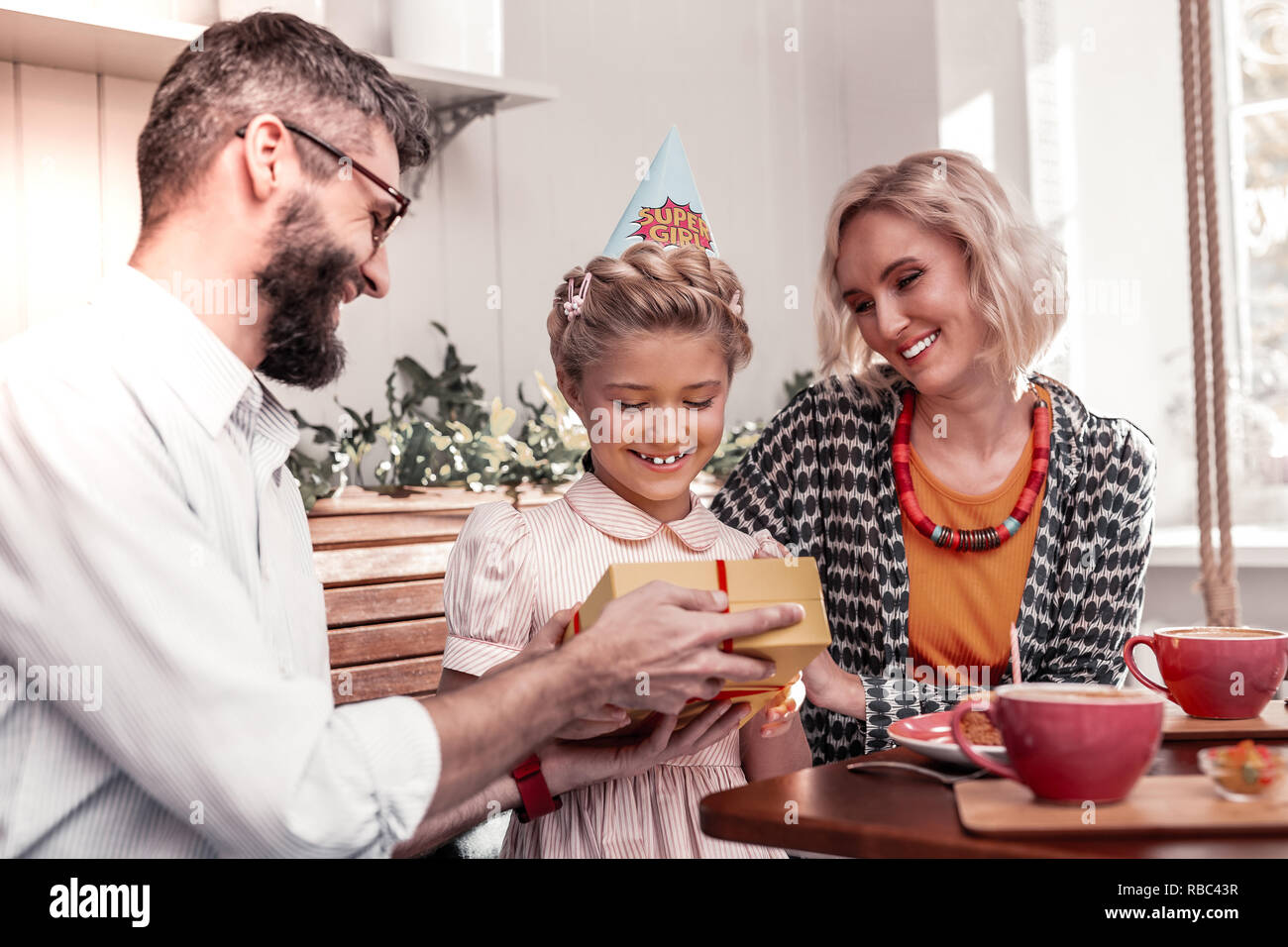 Joyful positive girl having her birthday party Stock Photo - Alamy