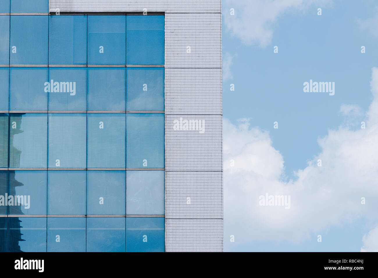 Skyscraper windows with blue sky cloud Stock Photo - Alamy