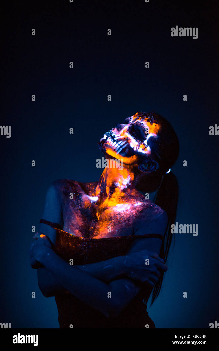 Girl's Face painted in fluorescent UV colors and looks like Neon ...