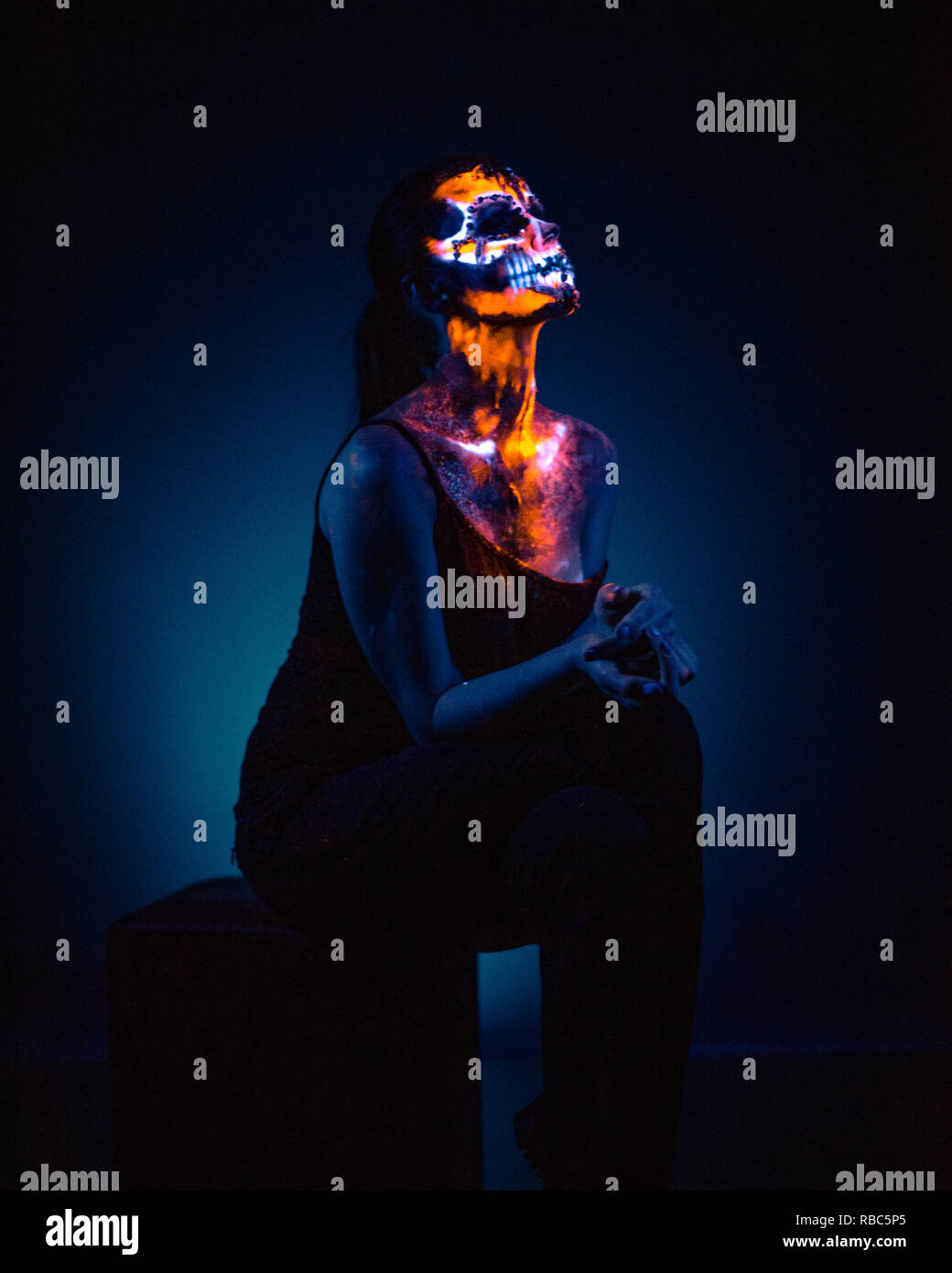 Girl's Face painted in fluorescent UV colors and looks like Neon ...