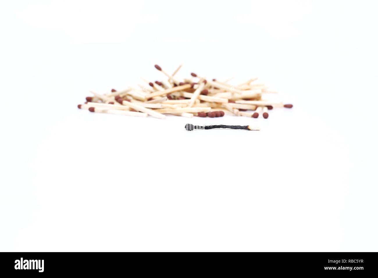 Picture of spread matchstick with one burnt matchstick. Isolated on the ...