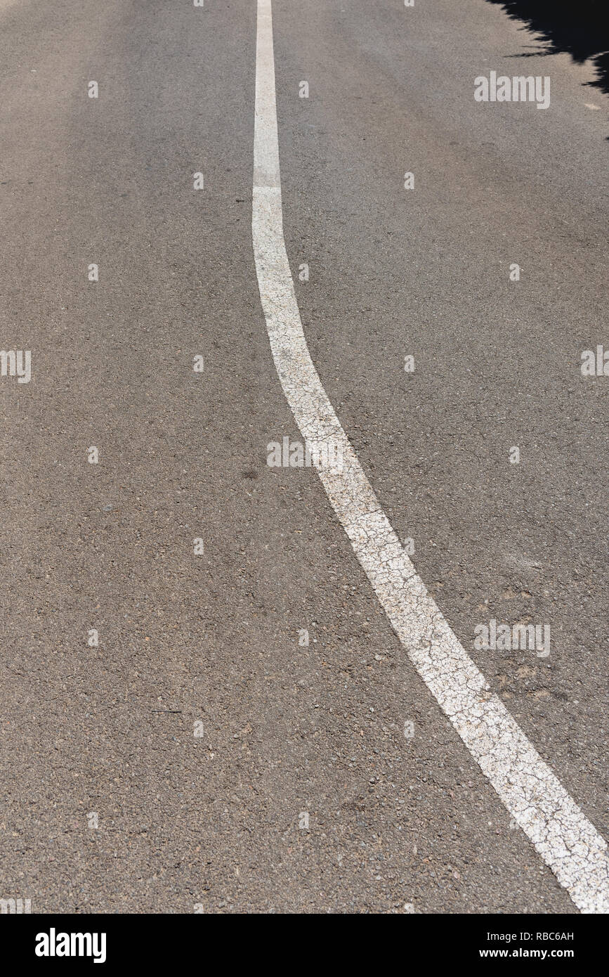 White direction road lines with black background and space for text ...
