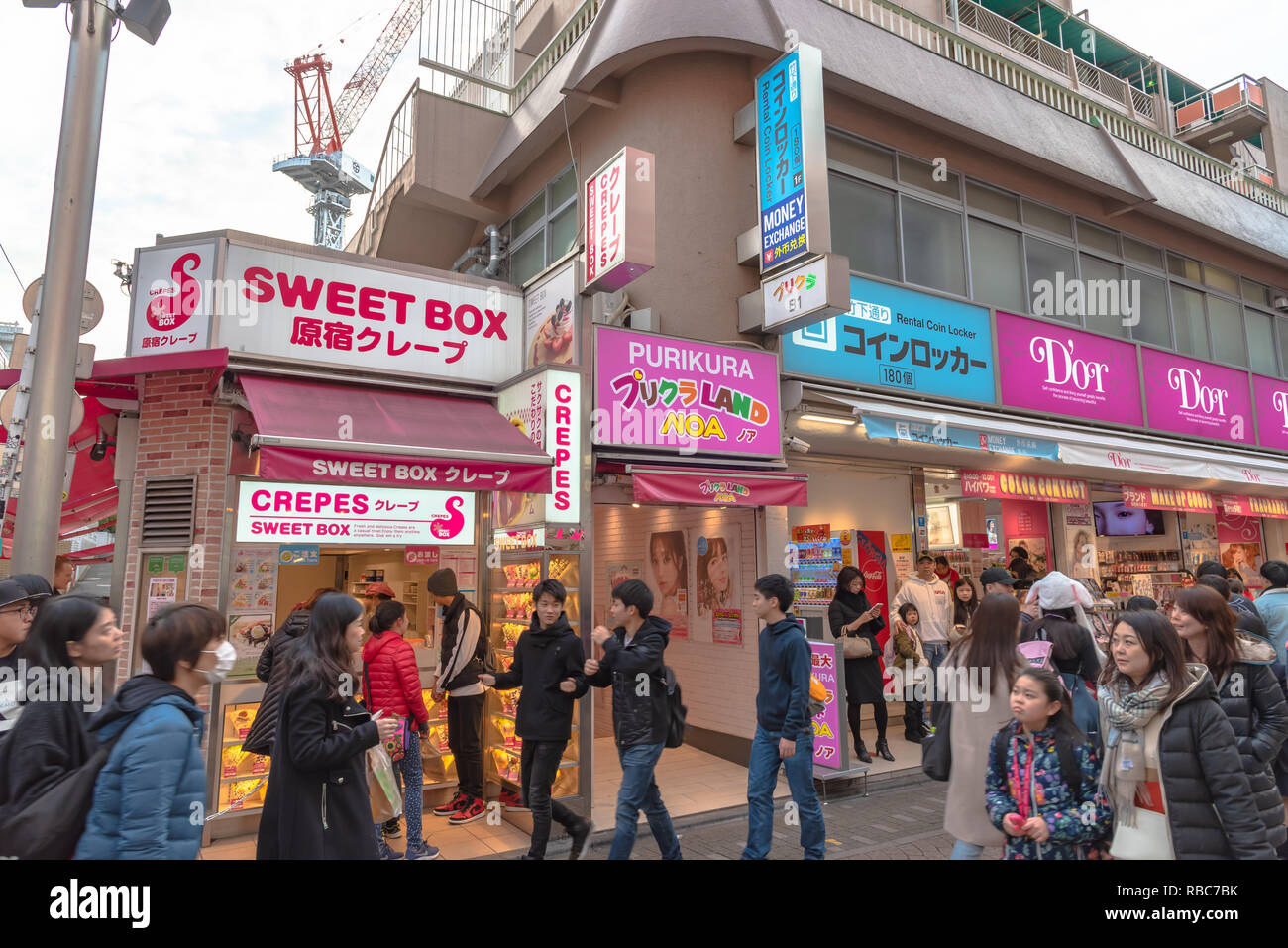 Harajuku street view. People, mostly youngsters, walk through Takeshita ...