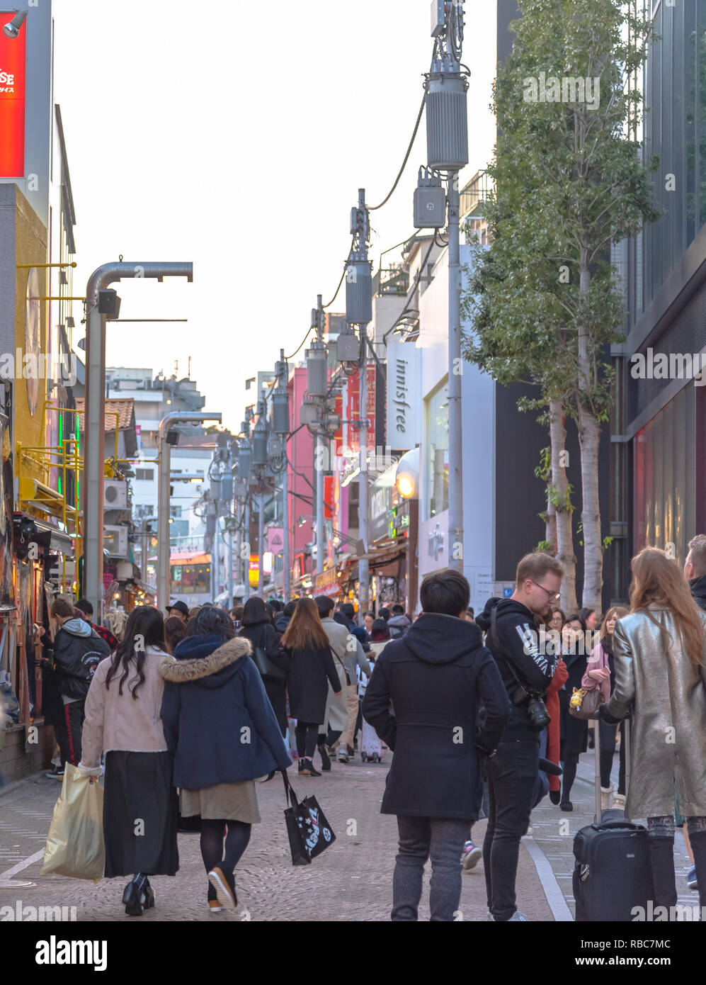 Harajuku street view. People, mostly youngsters, walk through Takeshita ...
