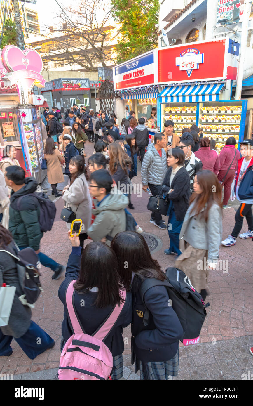 Harajuku street view. People, mostly youngsters, walk through Takeshita ...