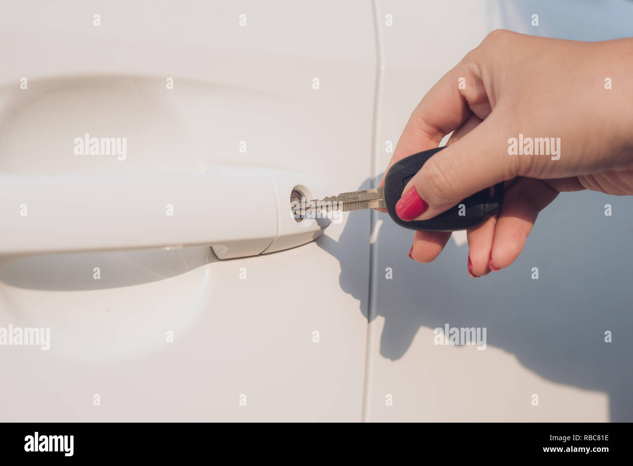 Closeup hand woman holding key opening car door Stock Photo - Alamy