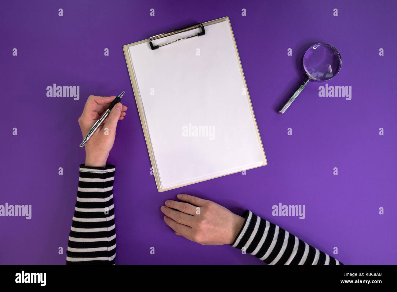 Clipboard notepad paper copy space mock up, top view of female hands ...