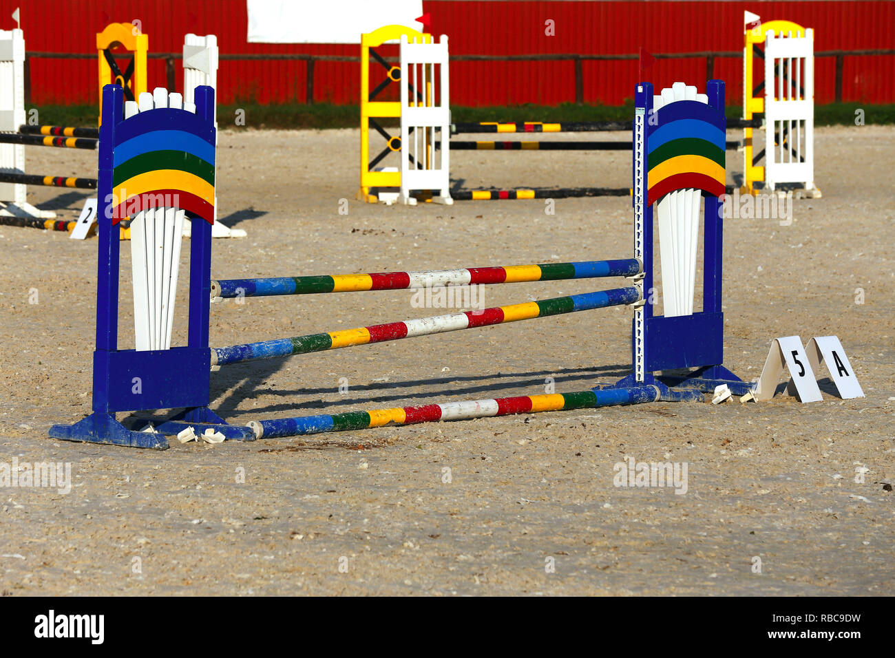 Colorful photo of equestrian obstacles. Empty field for horse jumping ...
