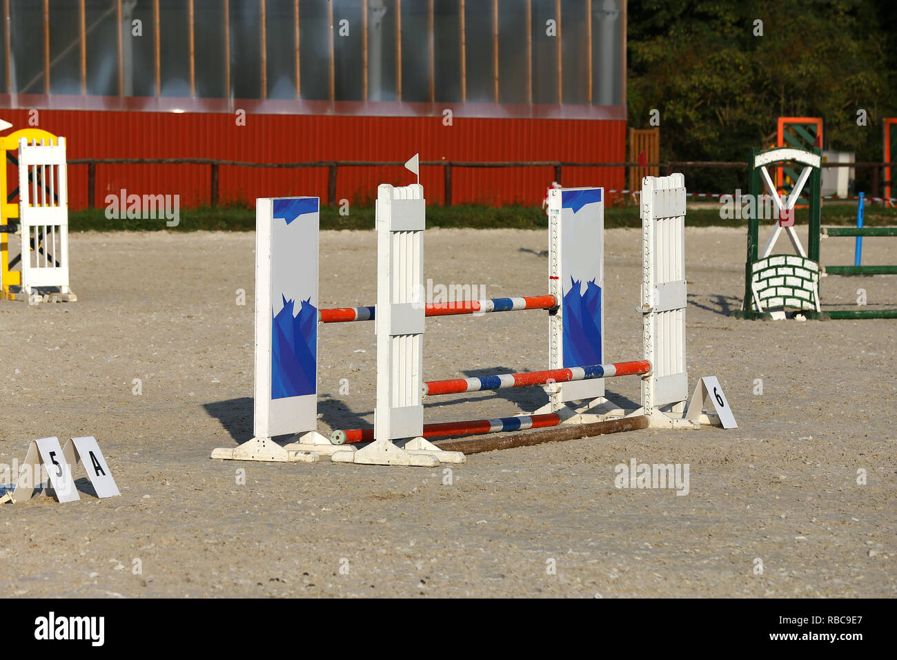 Colorful photo of equestrian obstacles. Empty field for horse jumping ...