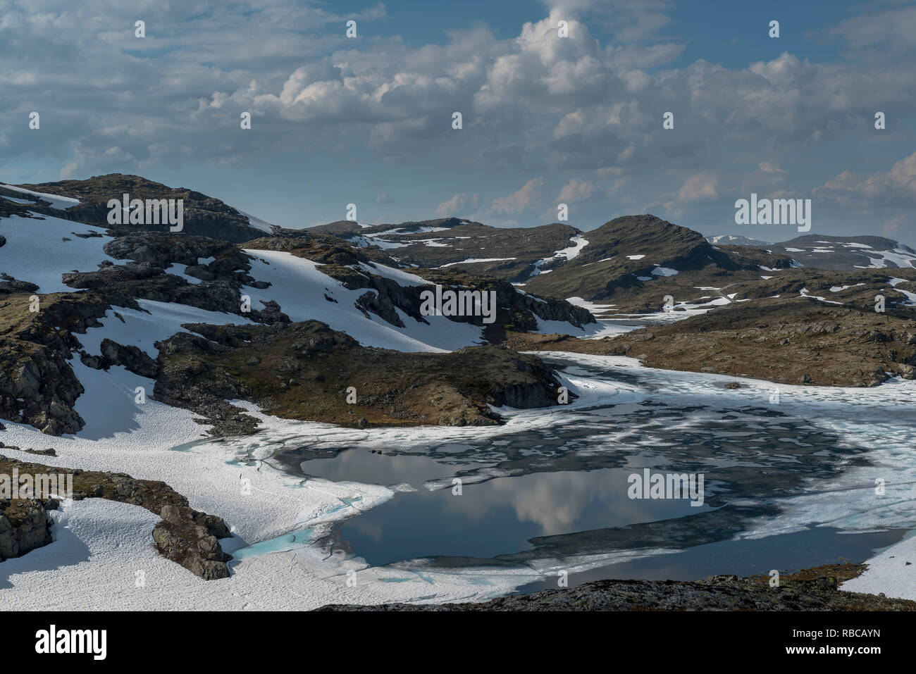 Springtime view of the mountain landscape with melting lakes in the ...