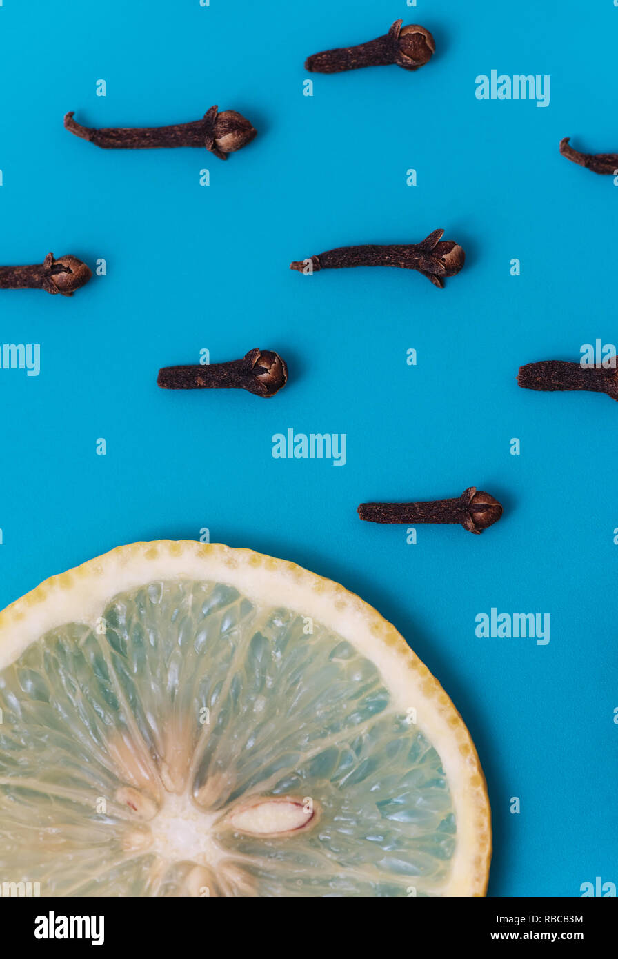 Still life with lemon and cloves. Flat lay Stock Photo - Alamy