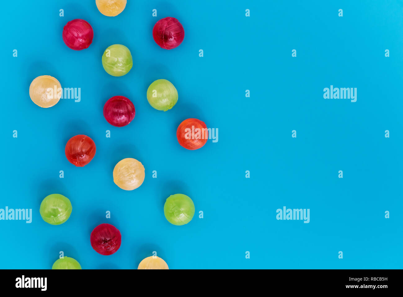 Still life of colorful spherical candies. Flat lay Stock Photo - Alamy