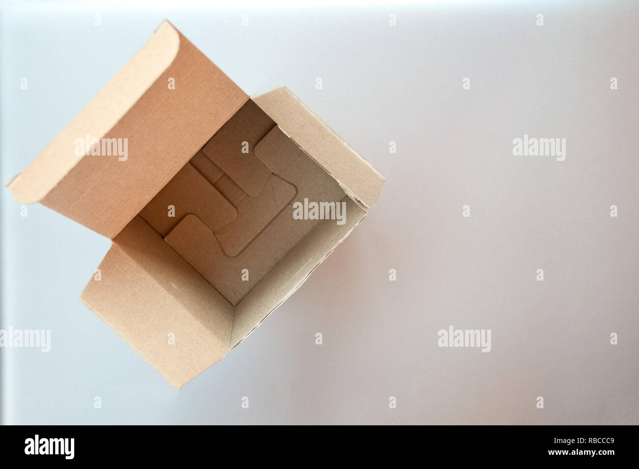 Opened big square cardboard craft gift box on the silver gray metal ...