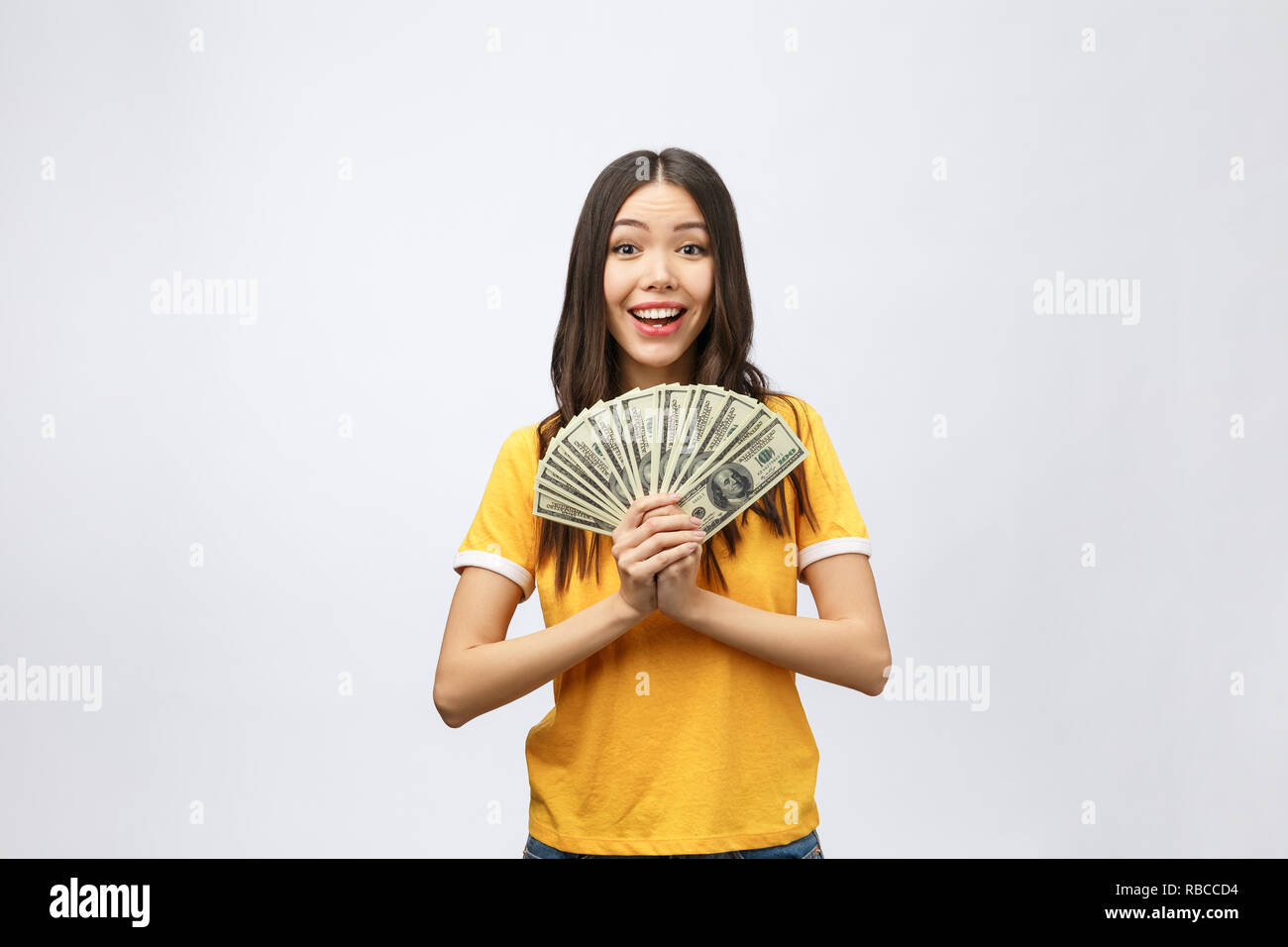 Woman holding bank money note. Pretty young model showing cash. Closeup ...