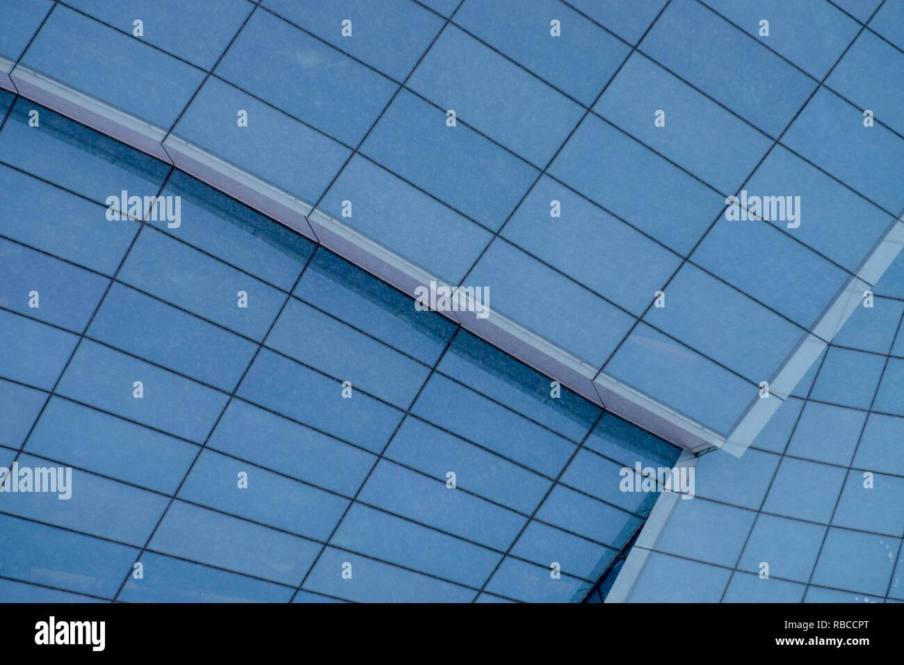 Patterns on a glass building Stock Photo - Alamy