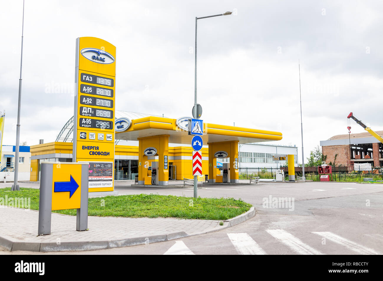 Rivne, Ukraine - July 23, 2018: Yellow Olas gas station fuel pump sign ...