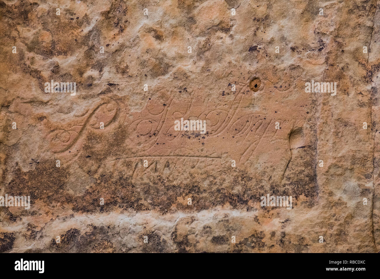 Elegant script of a name carved into the wall along the Inscription ...