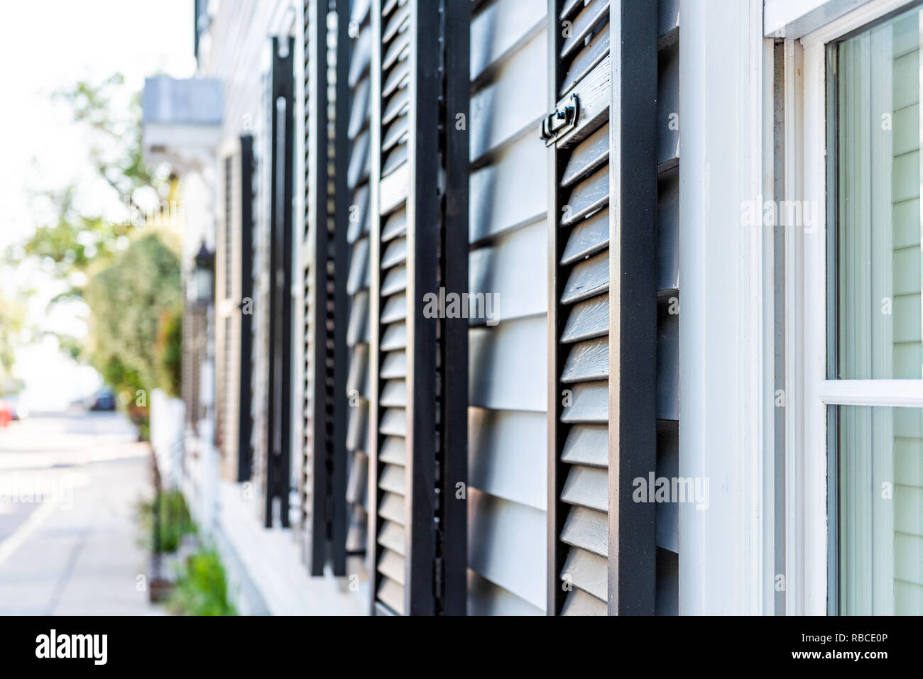 Black decorative row of window shutters closeup architecture open ...