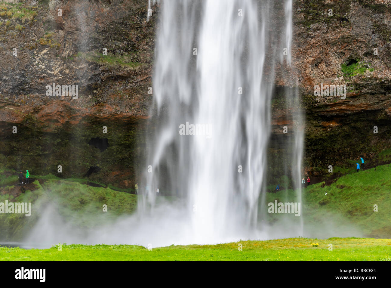 Closeup of Seljalandsfoss waterfall bottom in Iceland with white water ...
