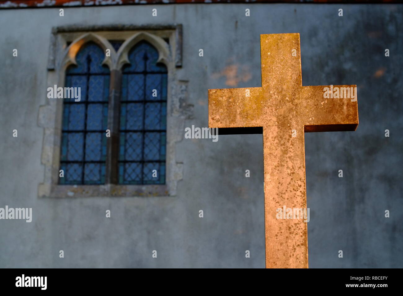 Cross shaped gravestone in a village churchyard Stock Photo - Alamy