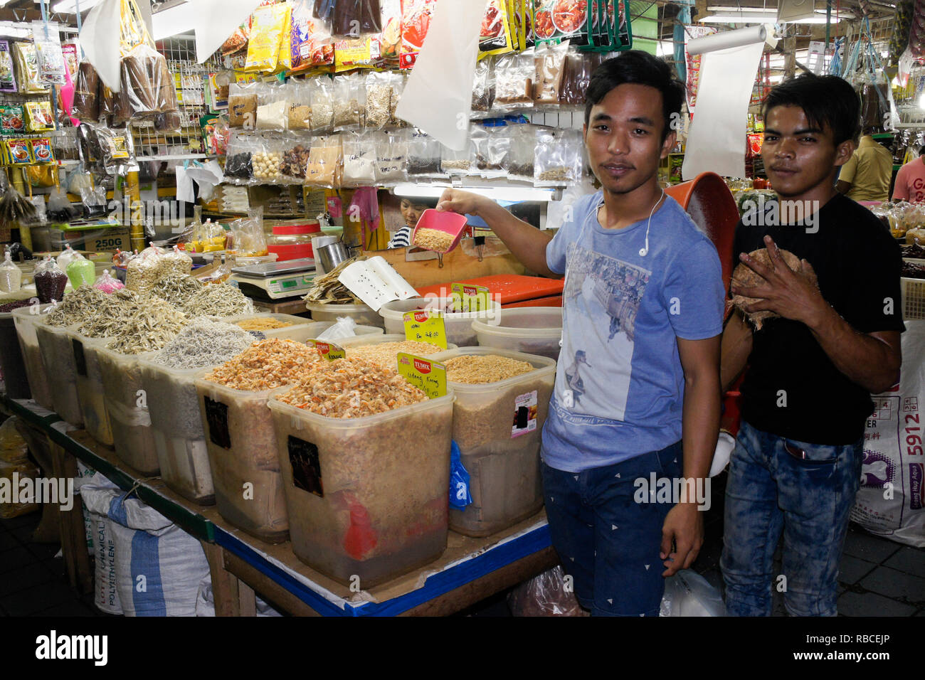 Young men selling dried fish at Central Market, Kota Kinabalu, Sabah ...