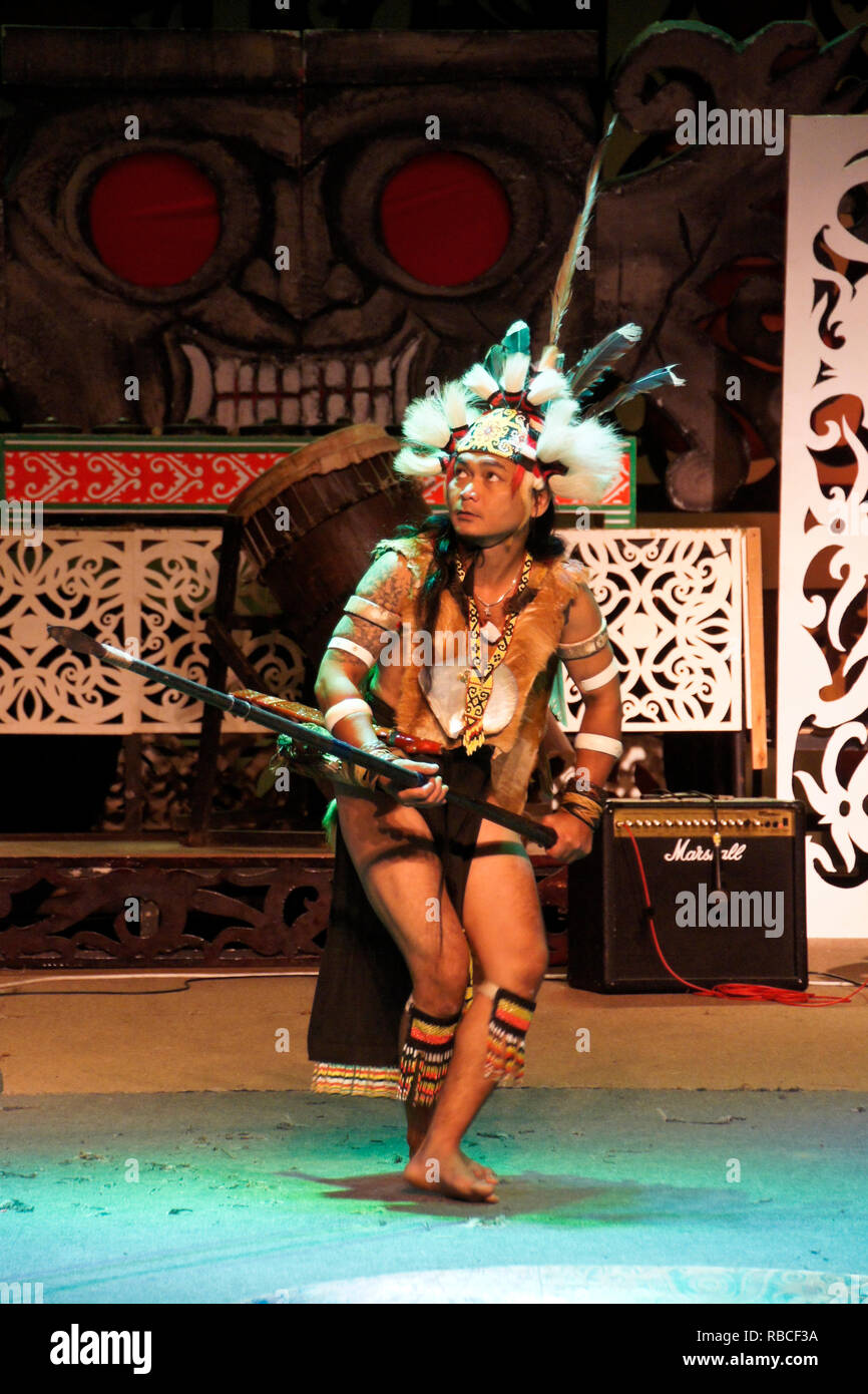 Orang Ulu tribal man performing Kanjet Ngeleput hunting dance, Sarawak ...