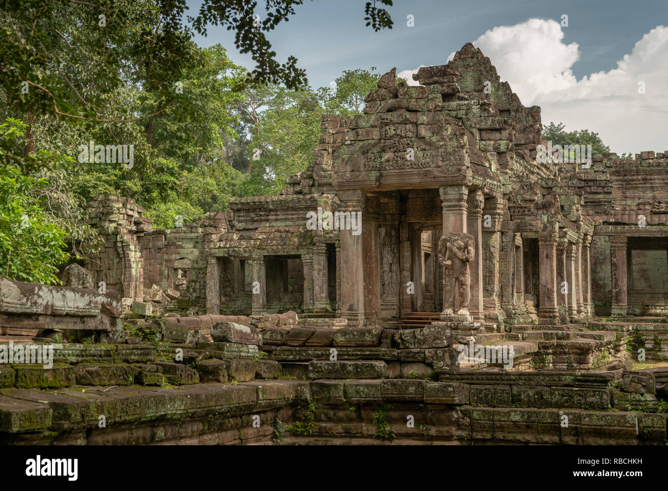 Facade of ruined stone temple in trees Stock Photo - Alamy