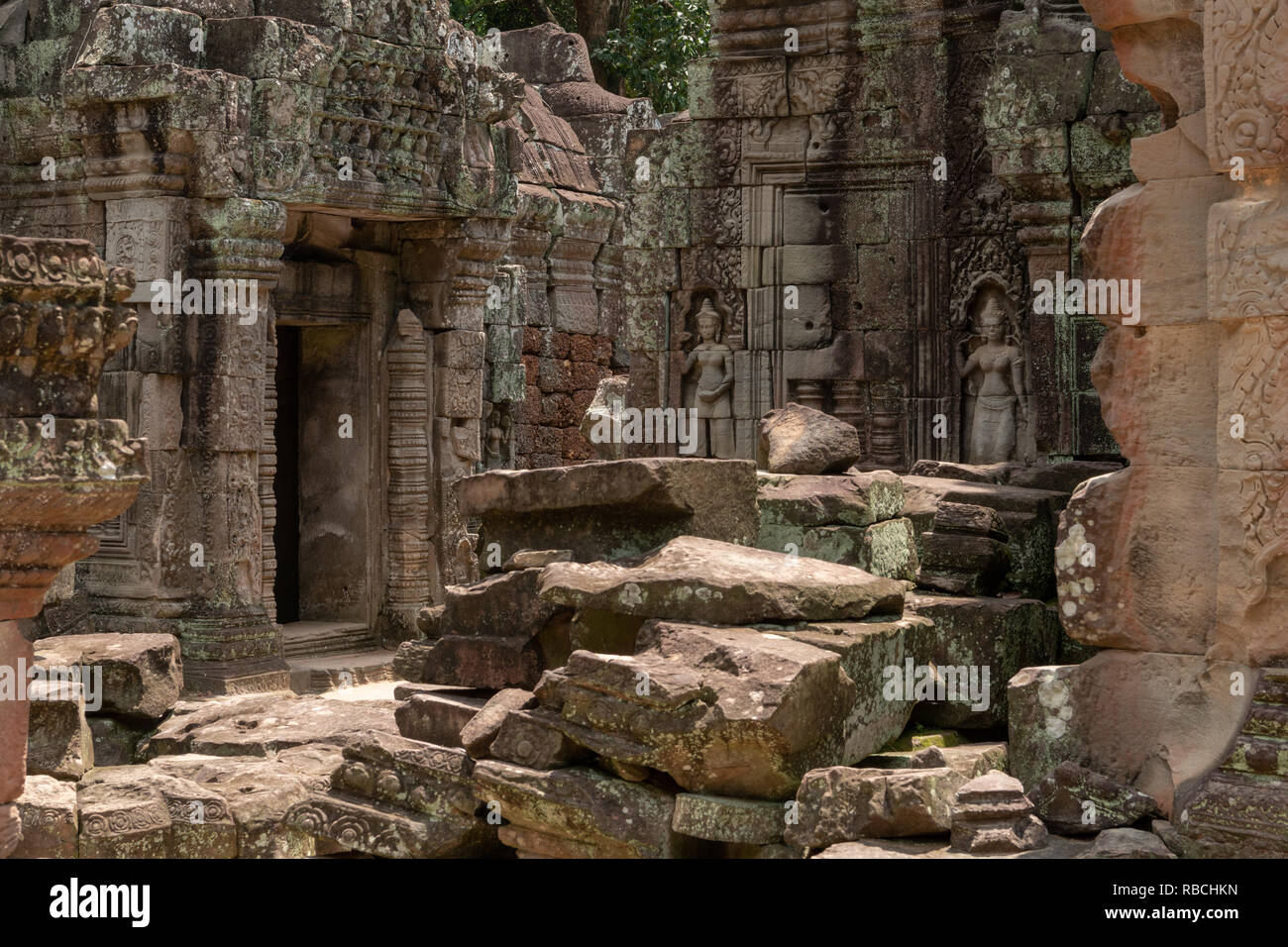Fallen blocks block courtyard by temple doorway Stock Photo - Alamy