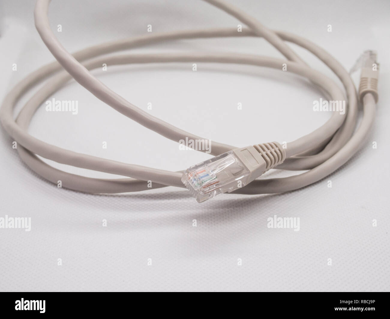 Telephone cable on white background Stock Photo - Alamy