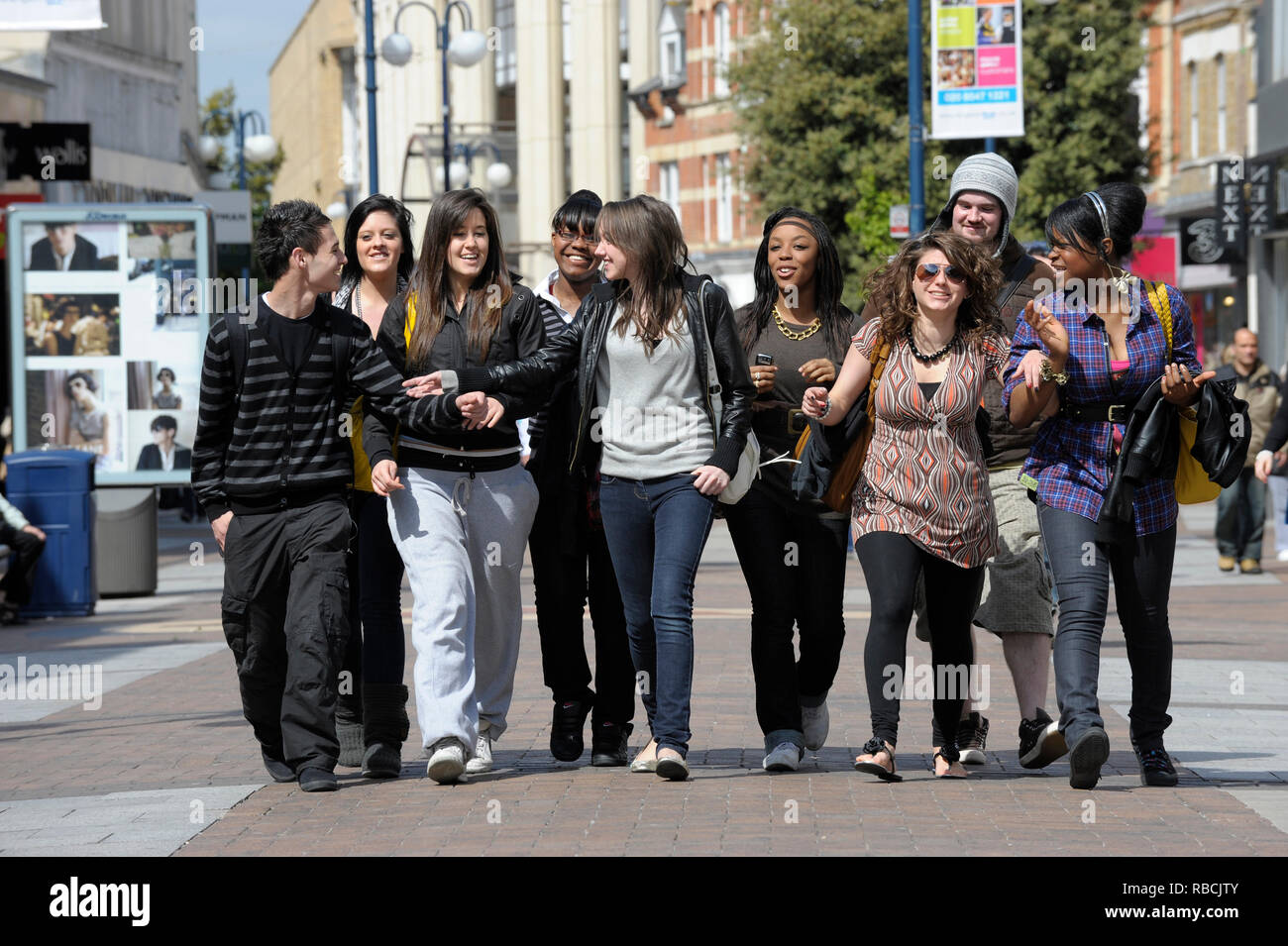 Teenagers hanging out together in Kingston-upon-Thames, Surrey, England ...