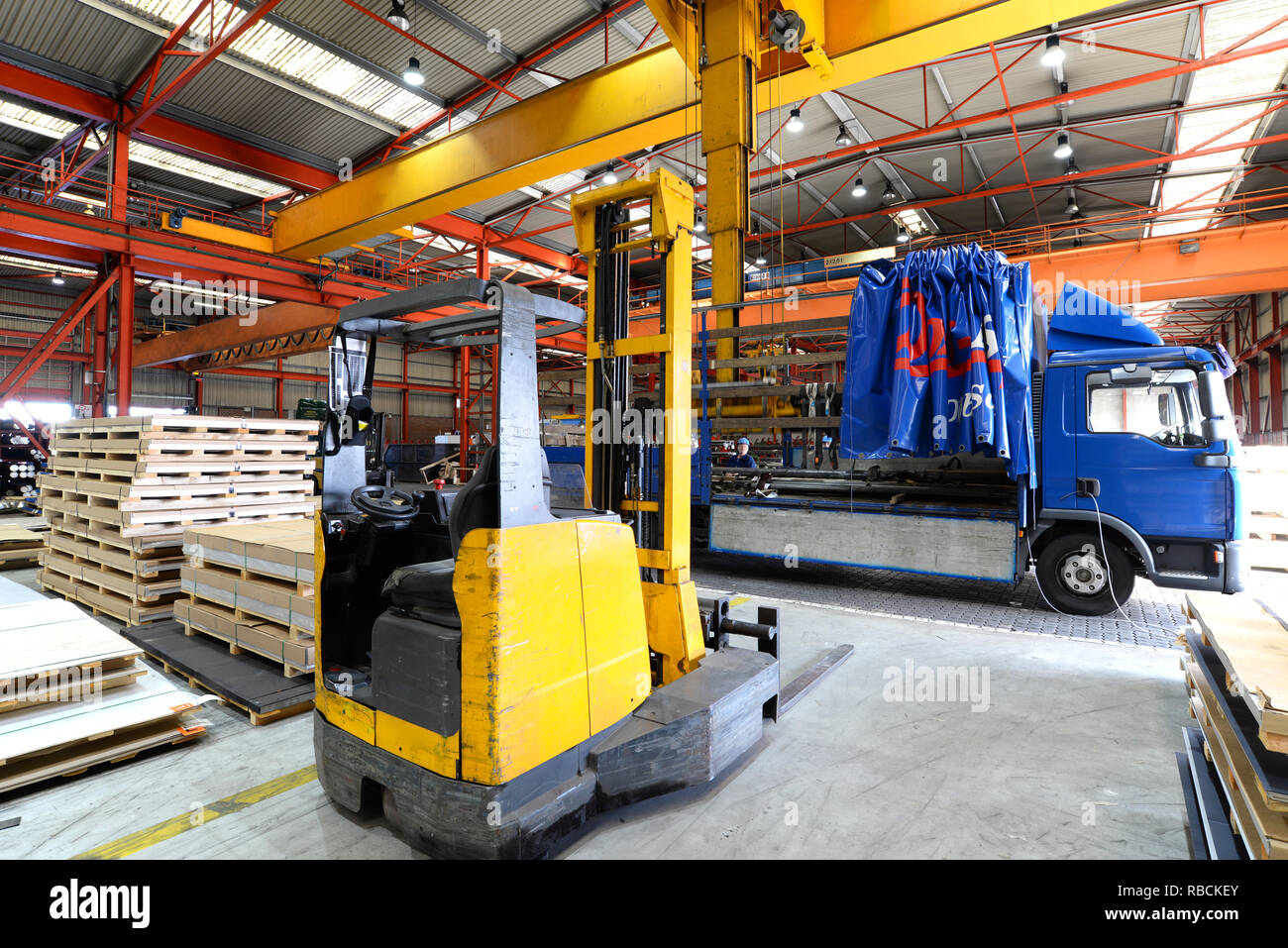 Sale and storage of industrial goods and steel in a factory hall Stock ...