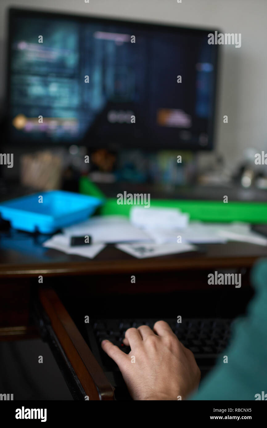 Teenage boy playing computer games at his desk Stock Photo - Alamy